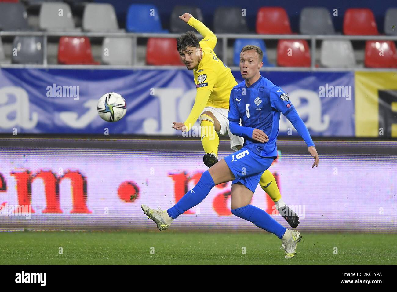 Andrei Ratiu and Gudmundur Thorarinsson in action during the FIFA World ...