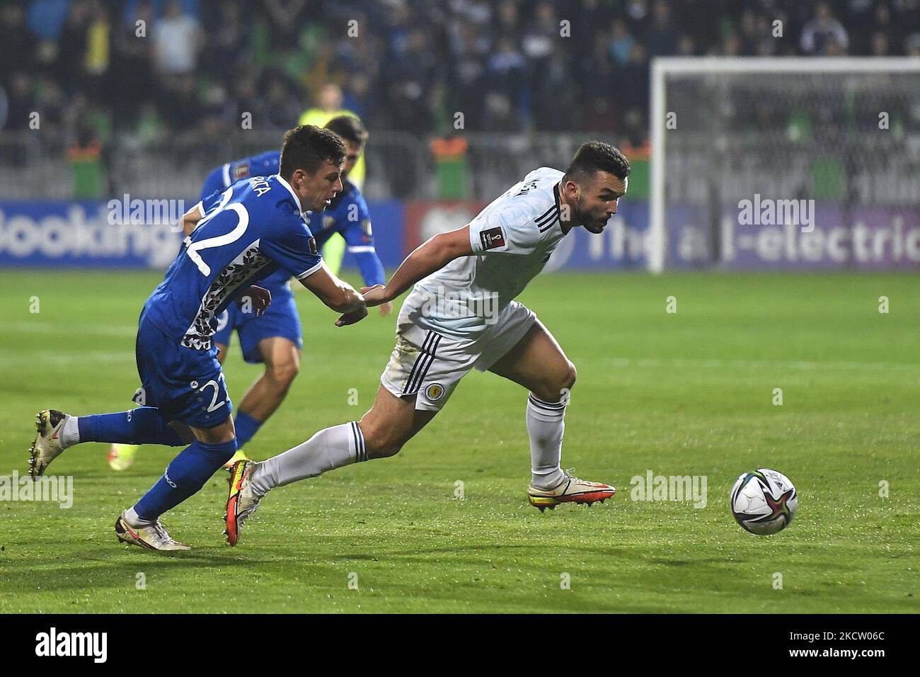 John McGinn and Vadim Rata in action during the Fifa World Cup 2022 ...