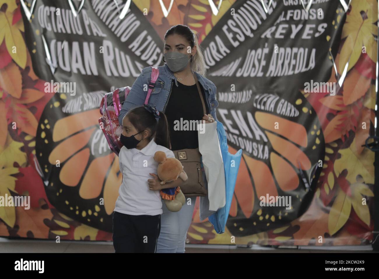 A woman and her daughter attend the Zócalo Book Fair in Iztapalapa ...