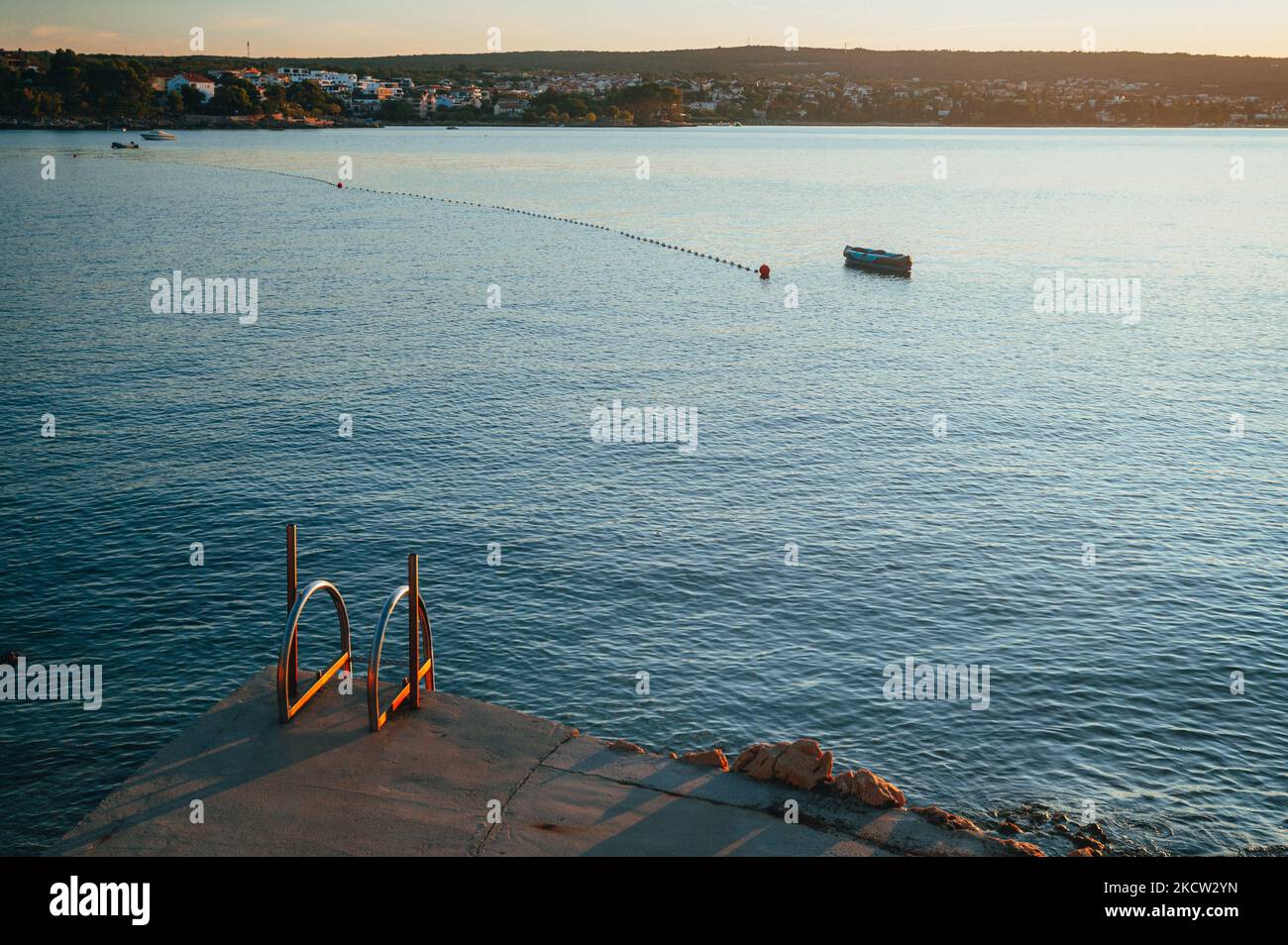 Pier and ladder. Entrance to the beach in the Mediterranean Sea. Photo ...