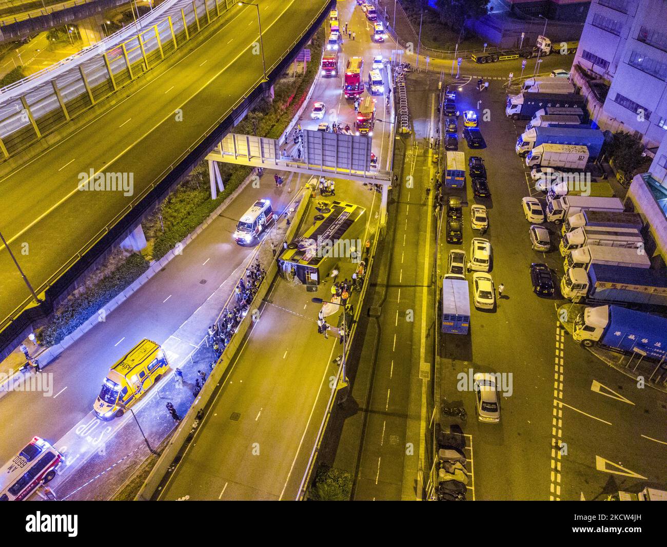 An Aerial Photograph showing The wreckage of a rolled over bus in Tai ...