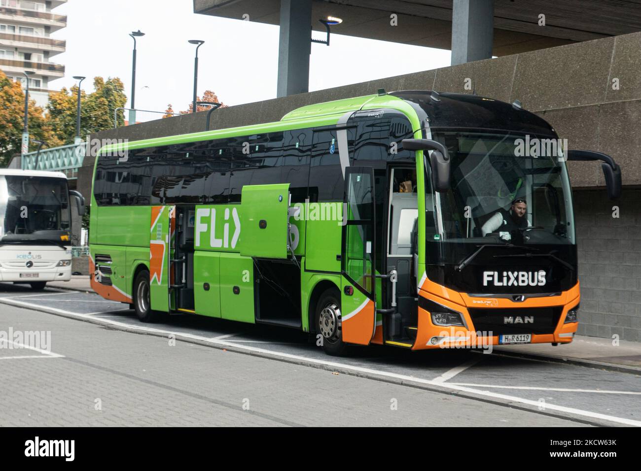 A green bus of FlixBus with the inscription and the brand logo on the ...