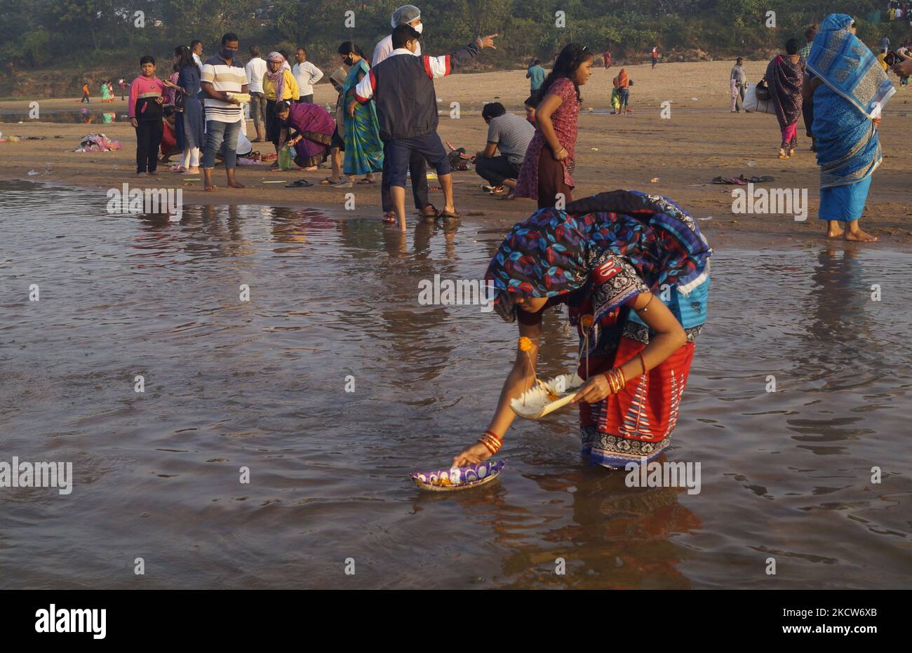 Devotees are seen on the bank of Daya river as they sail fancy boats ...
