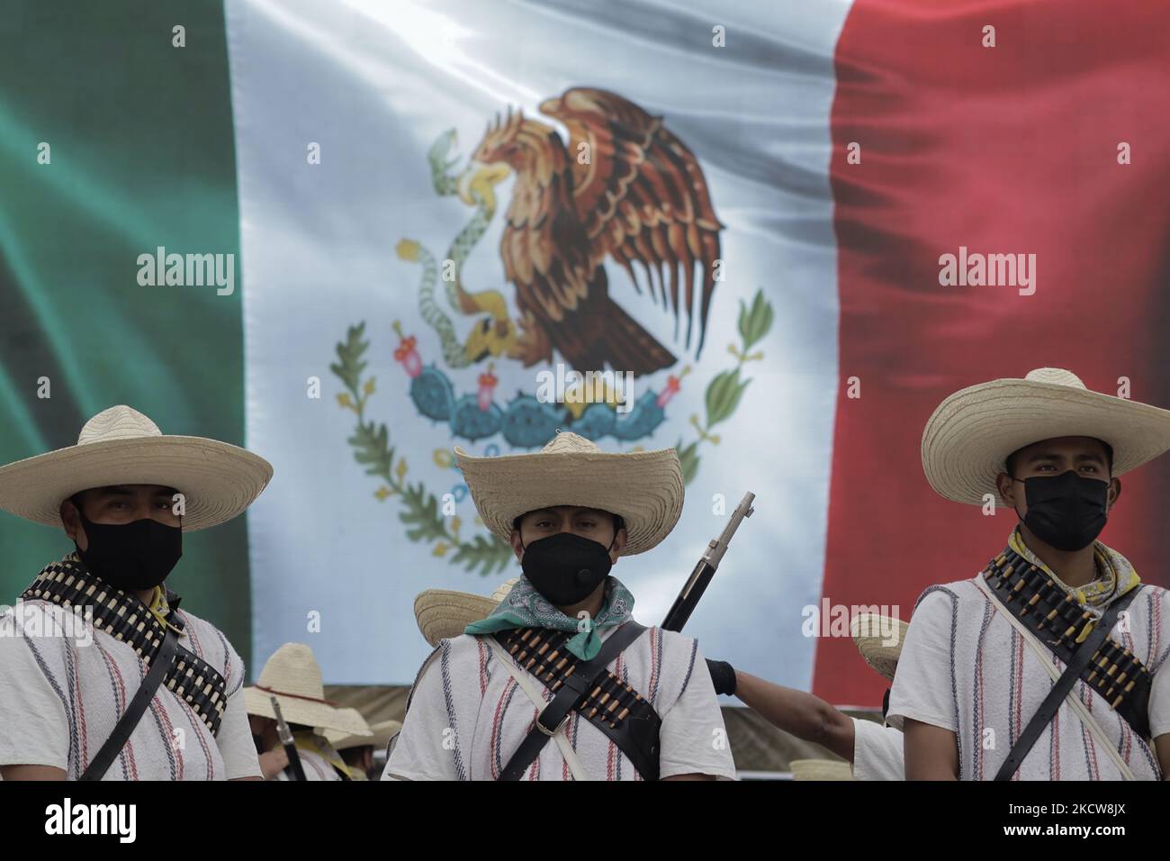Members of the Mexican army in costume get ready for the ceremony and ...