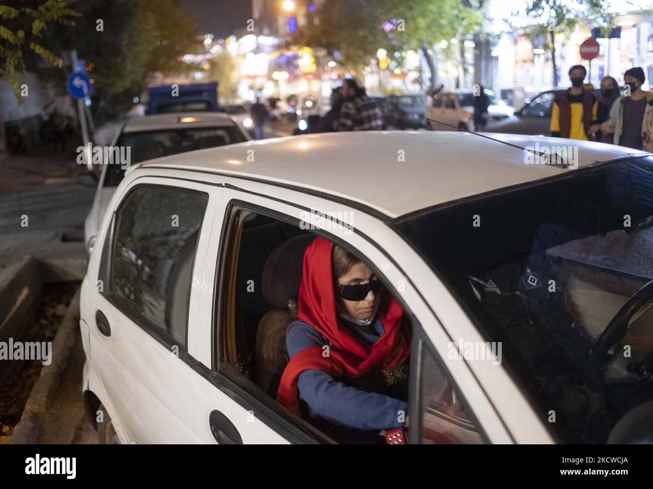 Masoumeh Ataei, who is a victim of an acid attack, sits in a vehicle ...