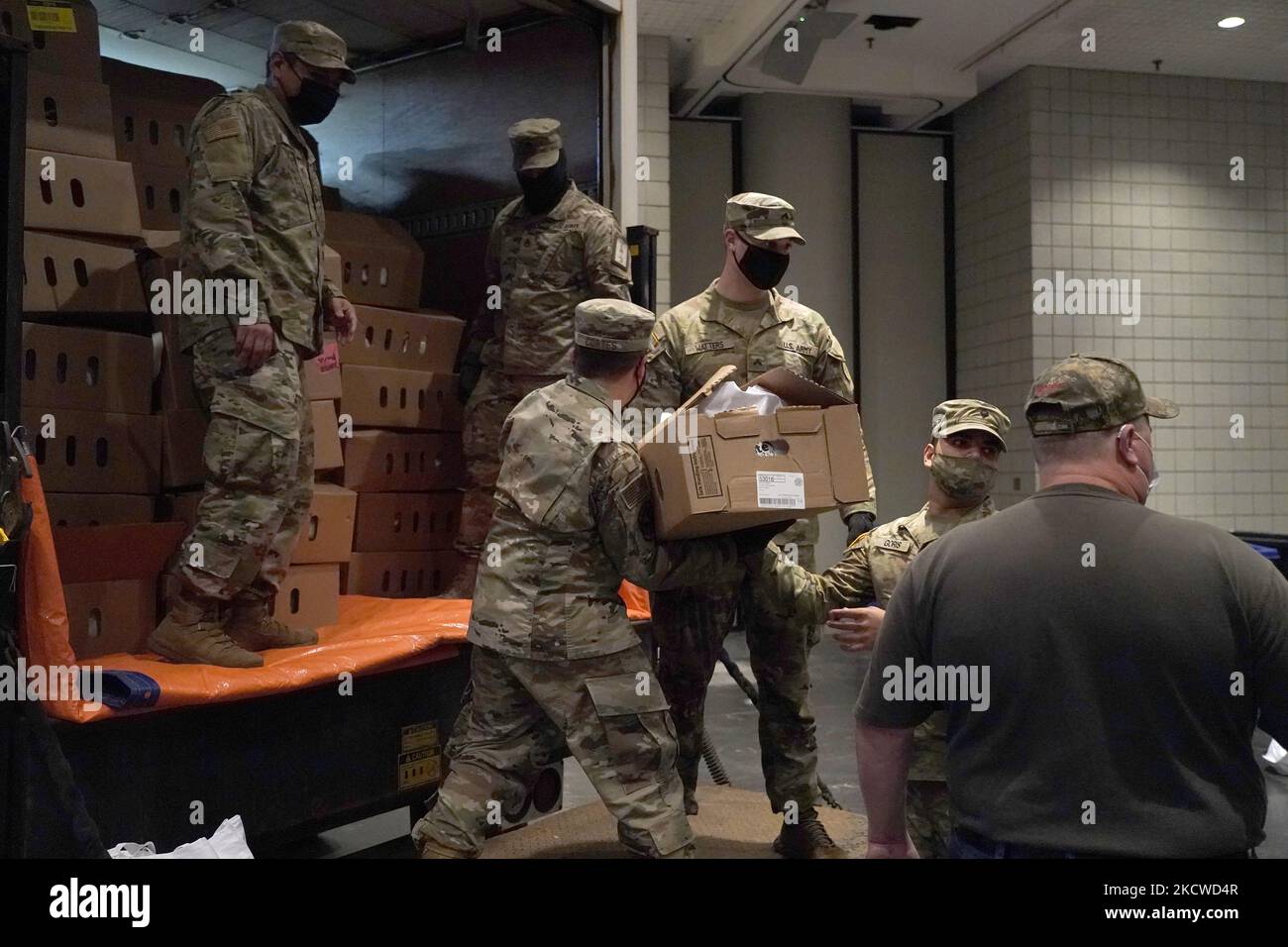 Us military personnel load boxes hi-res stock photography and images ...