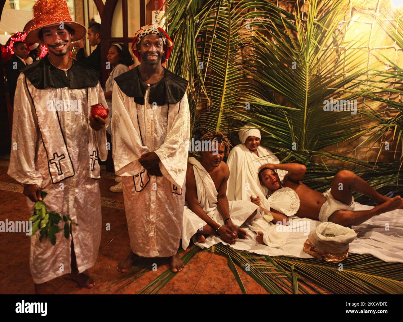 Satirical nativity pageant featuring youth dressed as priests standing ...