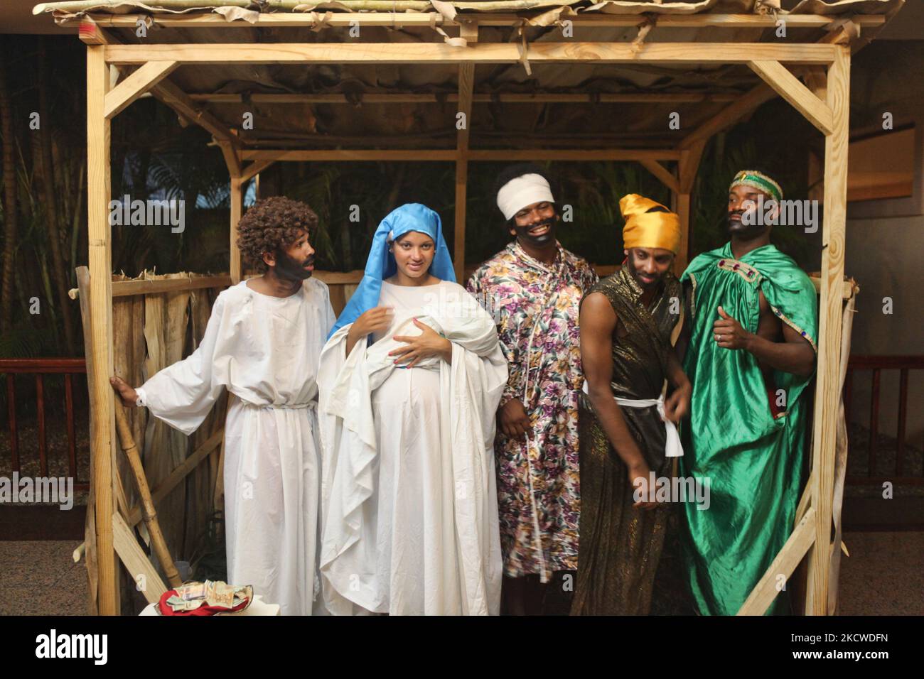 Satirical Nativity pageant featuring a pregnant Virgin Mary holding the ...