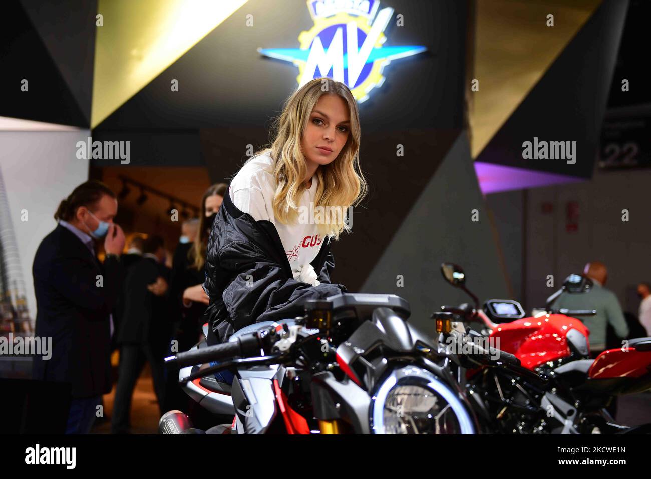 The models pose during EICMA, the international trade fair dedicated to ...