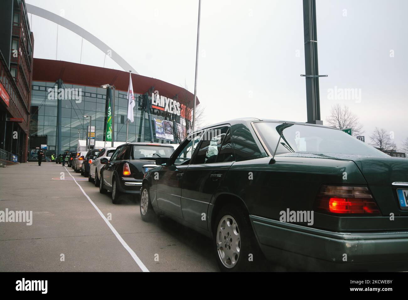 cars are seen waiting in front of Lanxess Arena in Cologne, Germany on ...