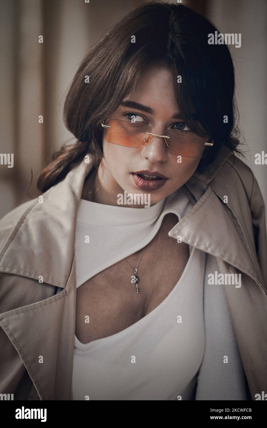 beautiful brunette girl in a sunglasses dressed in white blouse and ...