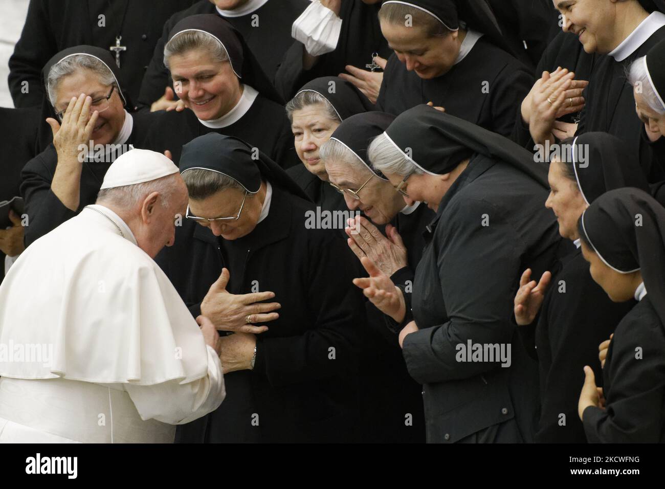 Pope Francis poses for as photo with a group of nuns at the end of his ...