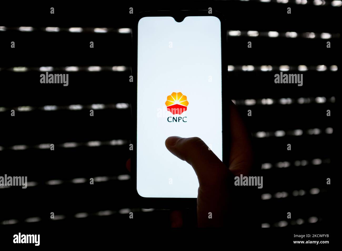 In this photo illustration a CNPC oil company is displayed on a ...