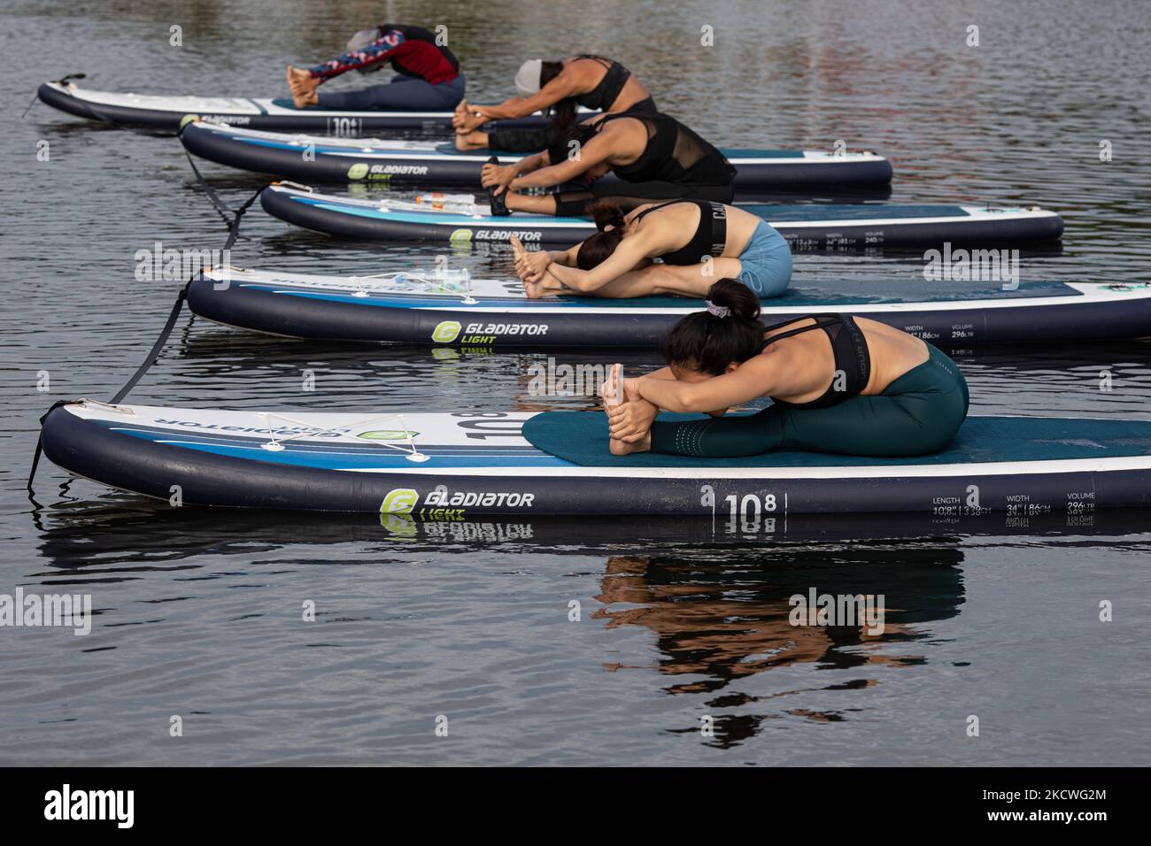 Stand up paddle board yoga activity in Ancol-Jakarta, Indonesia, on ...