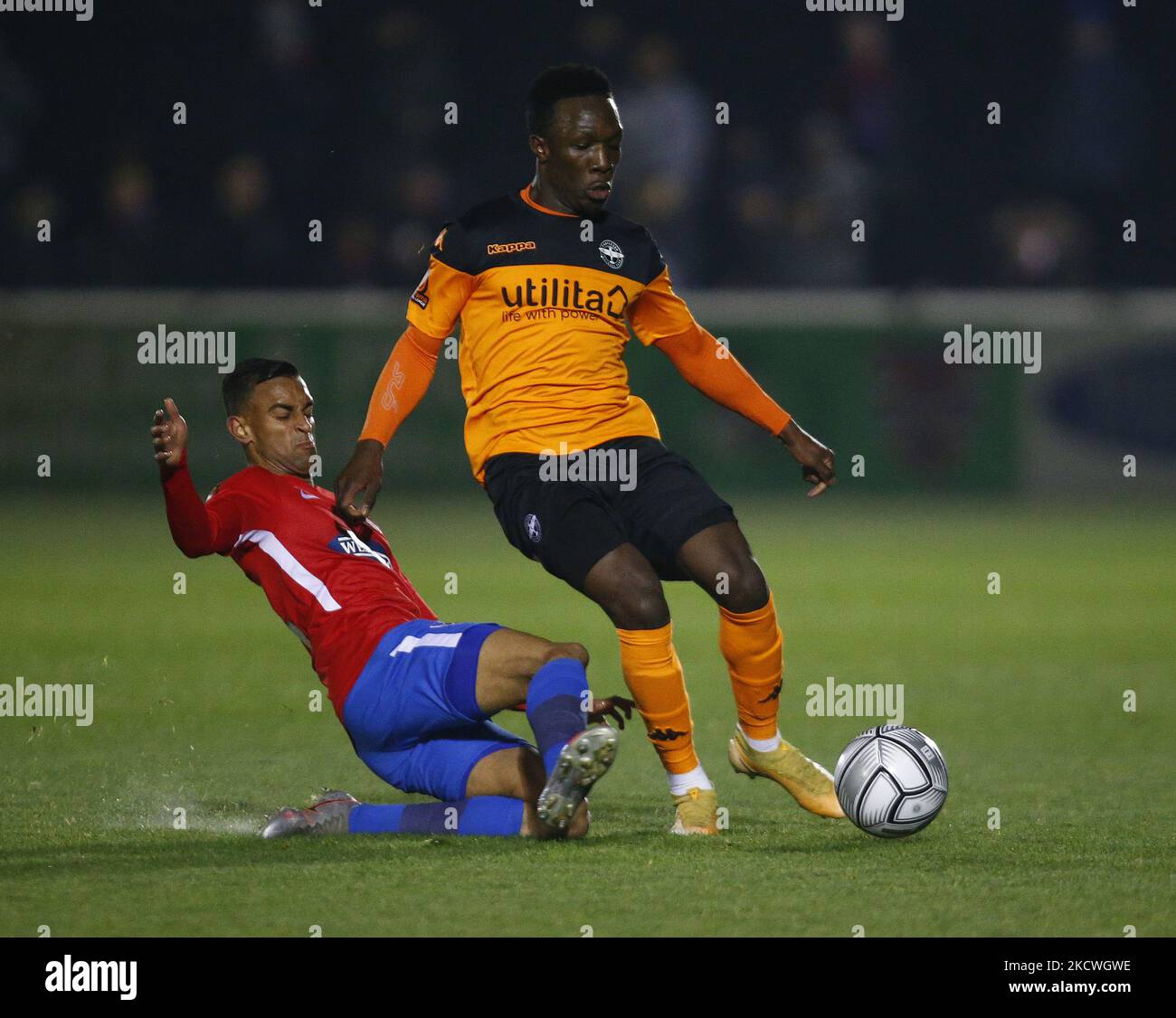 L-R Dagenham & Redbridge's George Saunders tackles Vincent Harper of ...