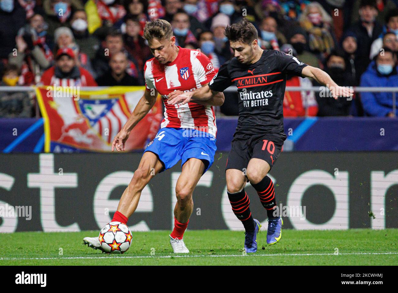 Marcos Llorente of Atletico de Madrid in action with Brahim Diaz of AC ...