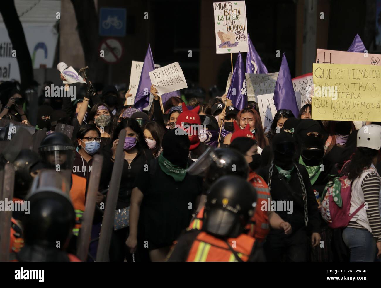 Members of the Feminist Black Bloc, march from the Angel of ...