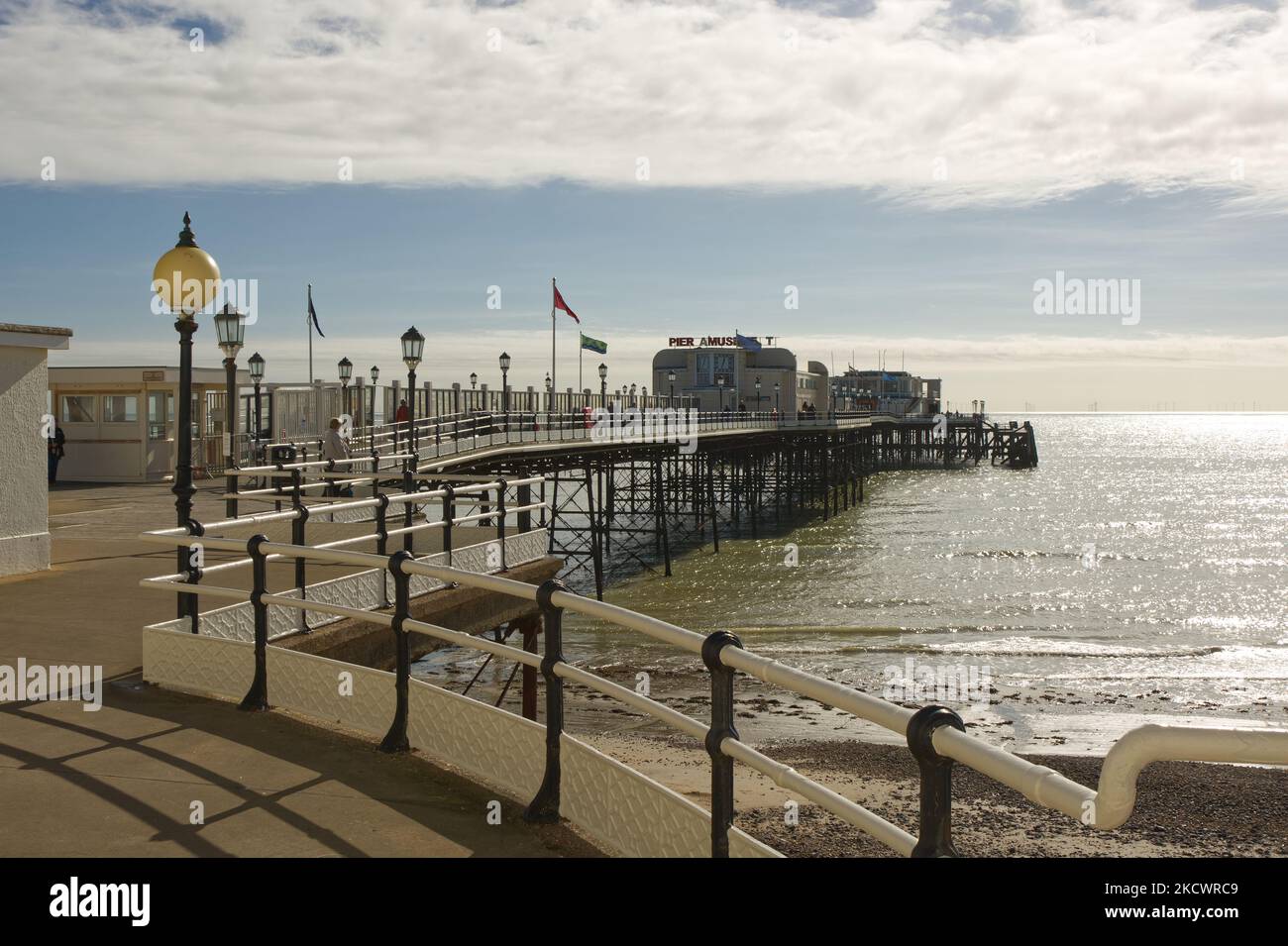 Pier, beach and seafront at Worthing in West Sussex, England. With ...
