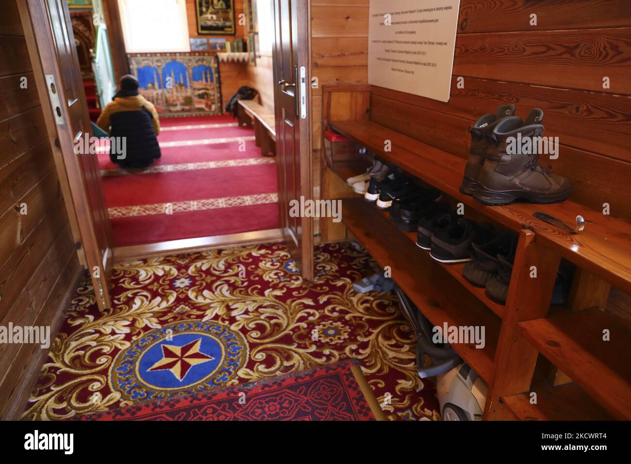 A faithful prays inside mosque in Bohoniki, Poland on November 21, 2021 ...