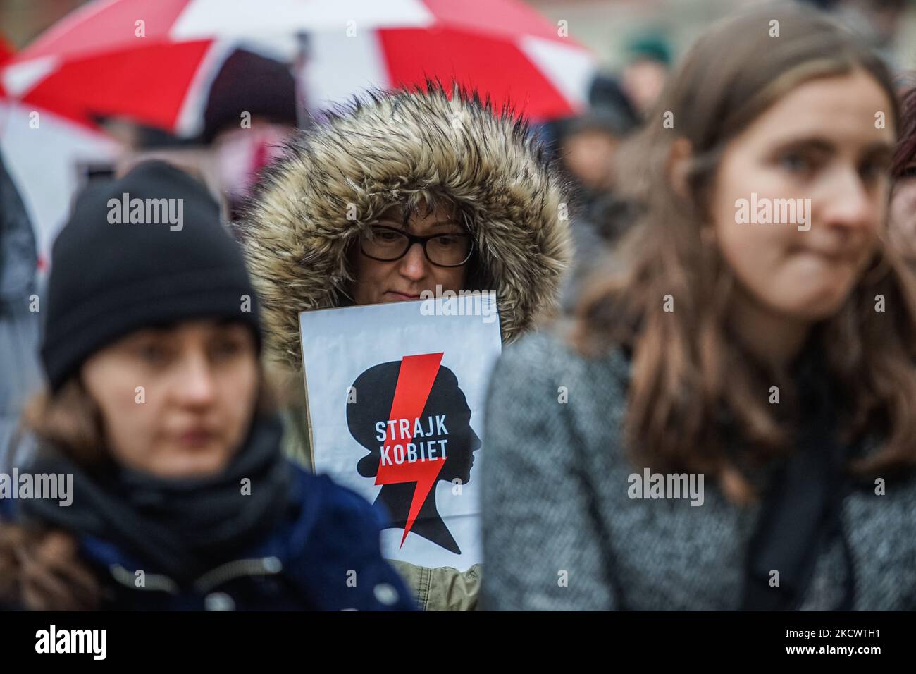 Protester holding banner with Women Strike logo is seen in Gdansk ...