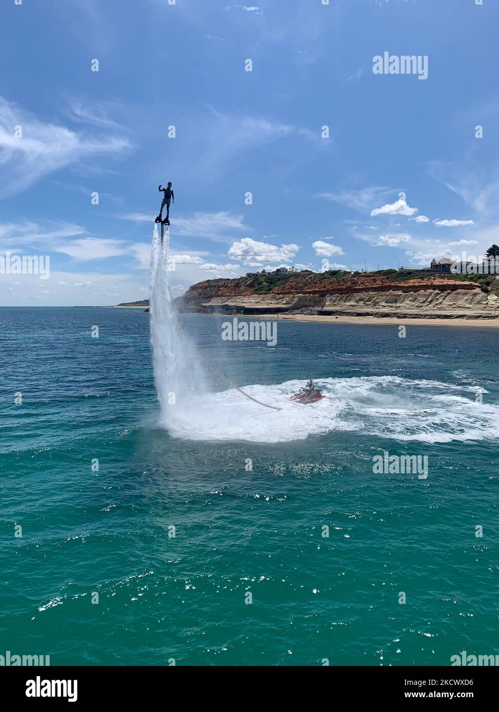 Water extreme sport. The guy is flying at the aquatic flyboard Stock ...