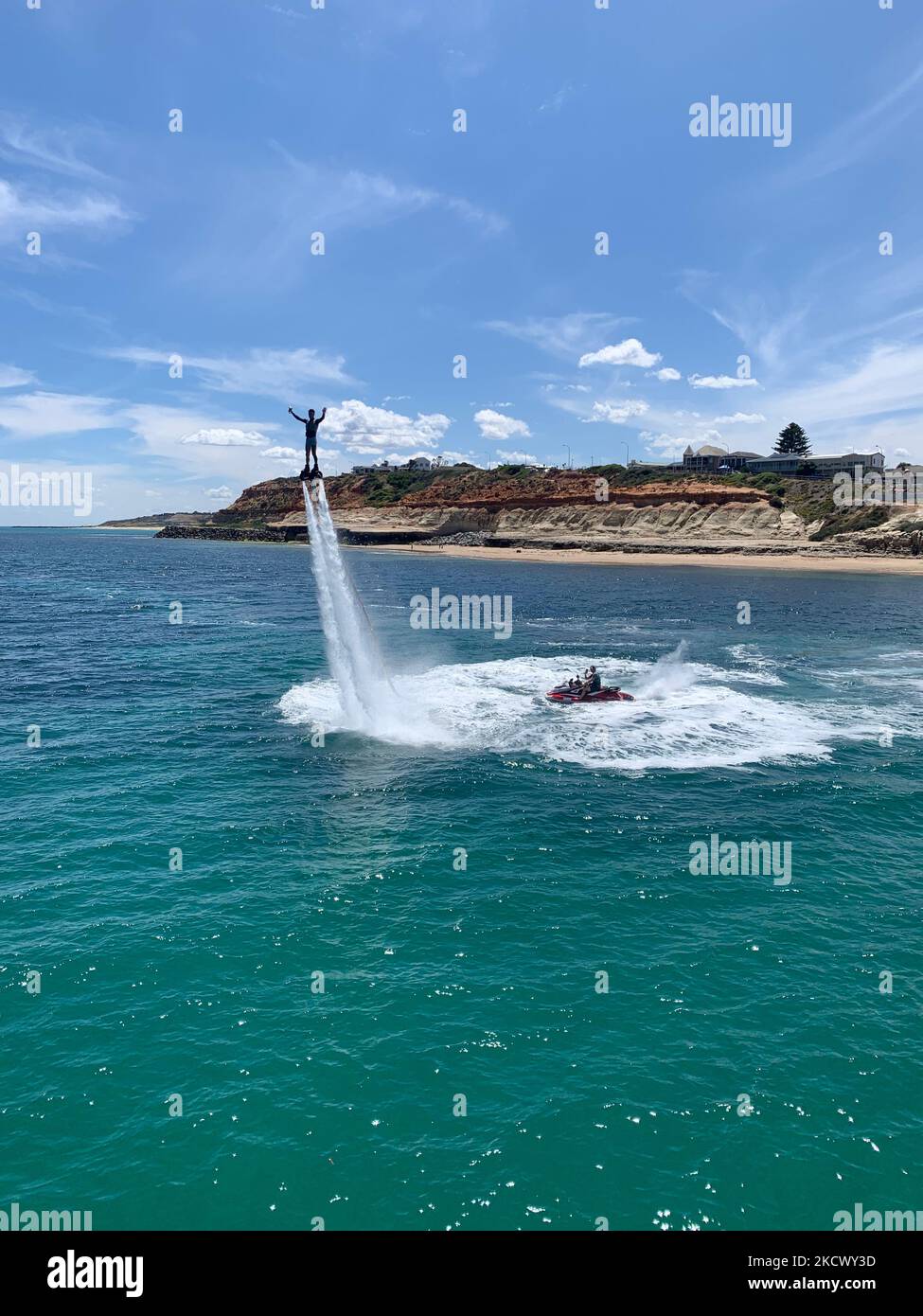 Water extreme sport. The guy is flying at the aquatic flyboard Stock ...