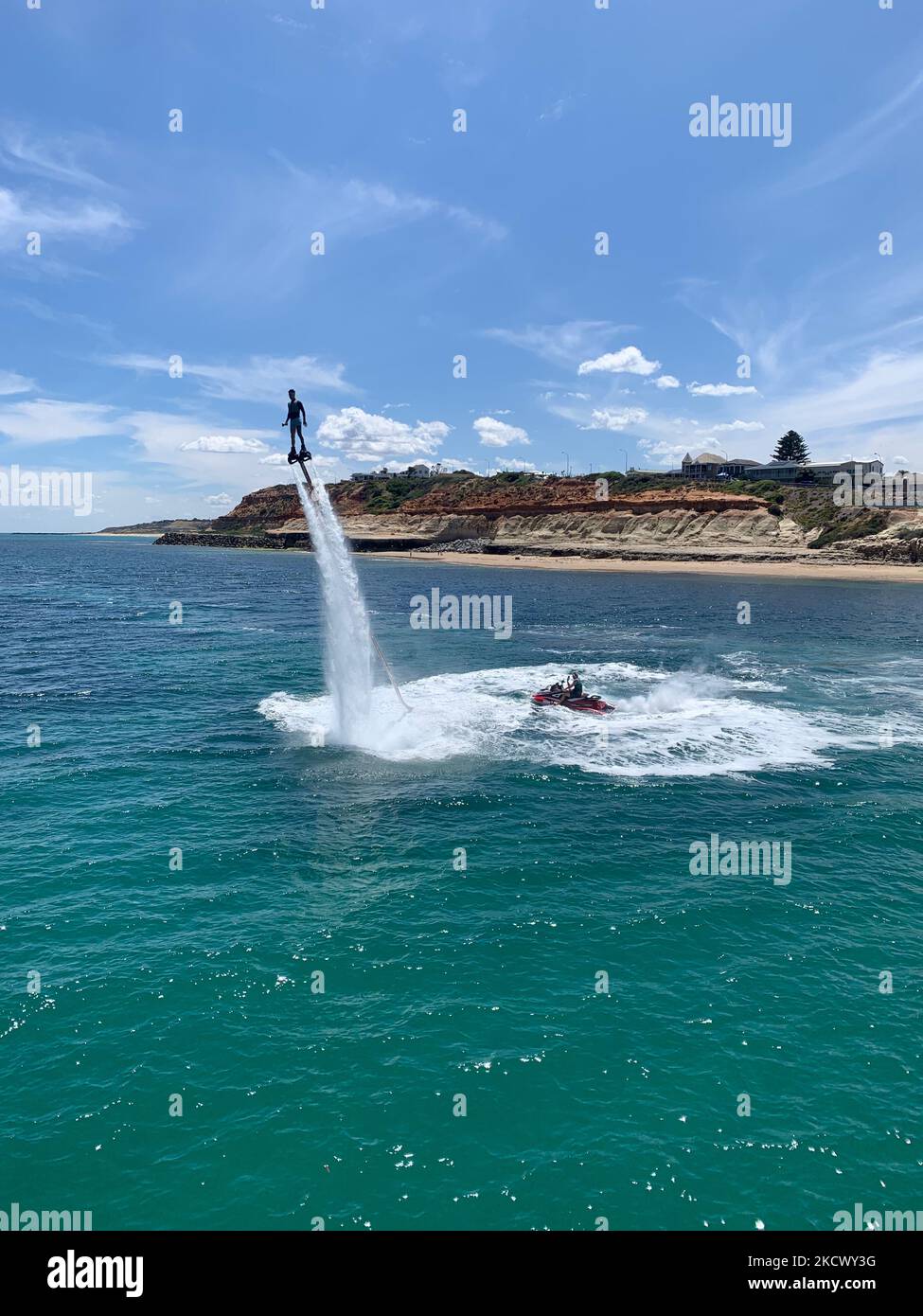 Water extreme sport. The guy is flying at the aquatic flyboard Stock ...