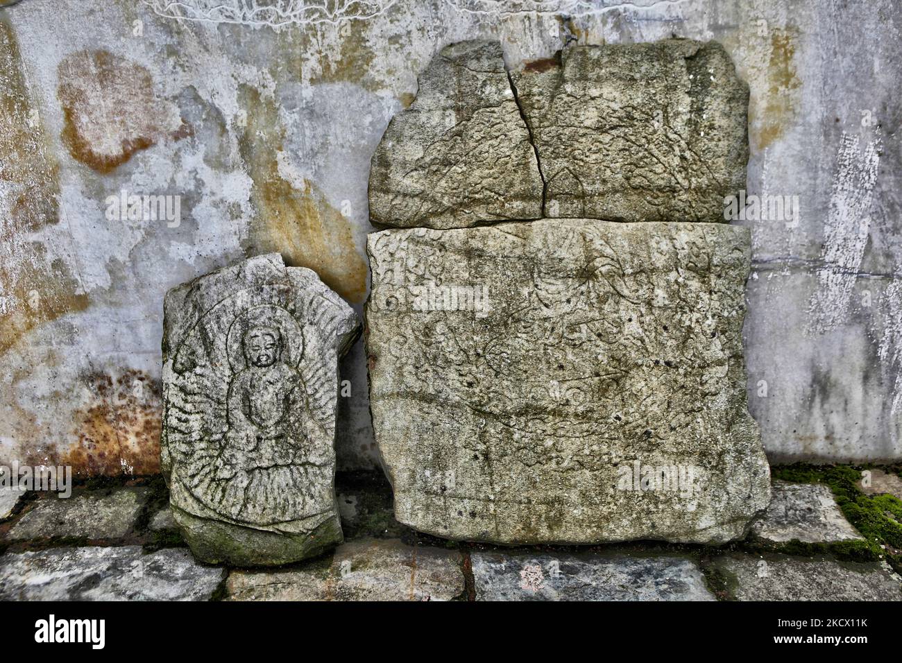 Ancient carved stones with the images of Buddhist deities at a ...