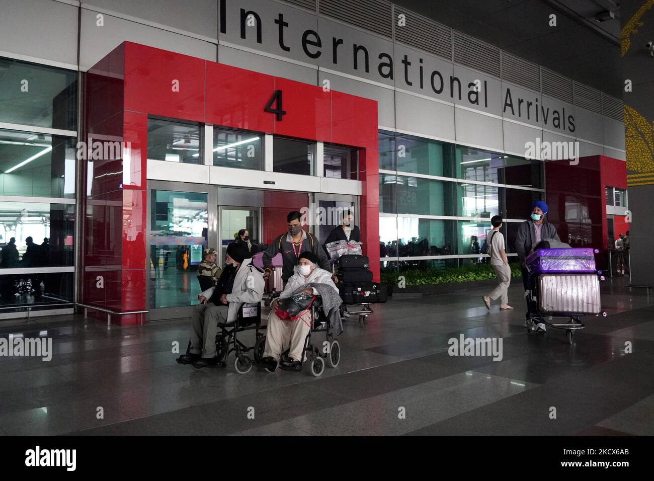Passengers exit from the arrivals area for international travellers, amidst the coronavirus ...