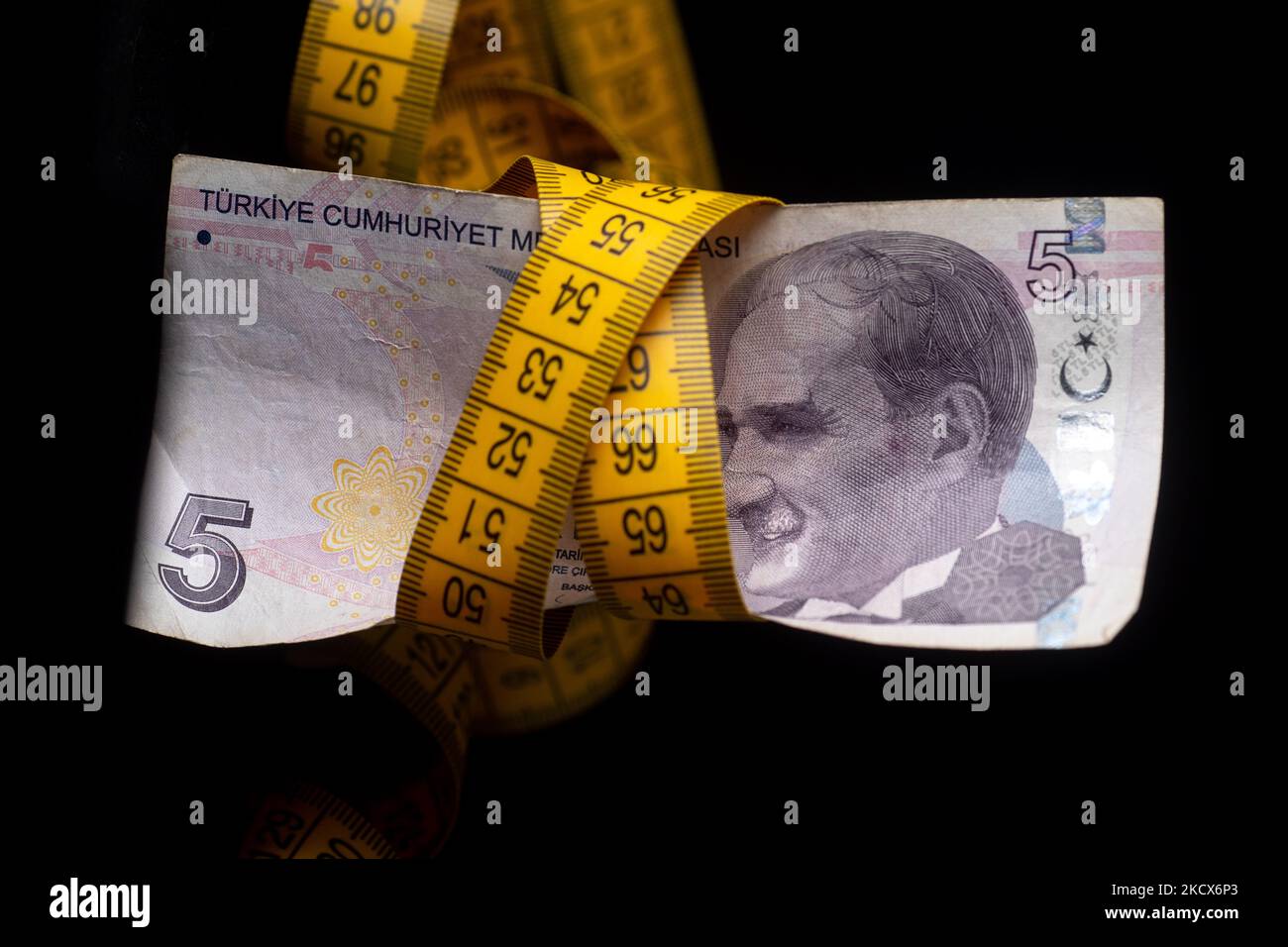 Photo Illustration of Turkish Lira banknotes in black background and a ...