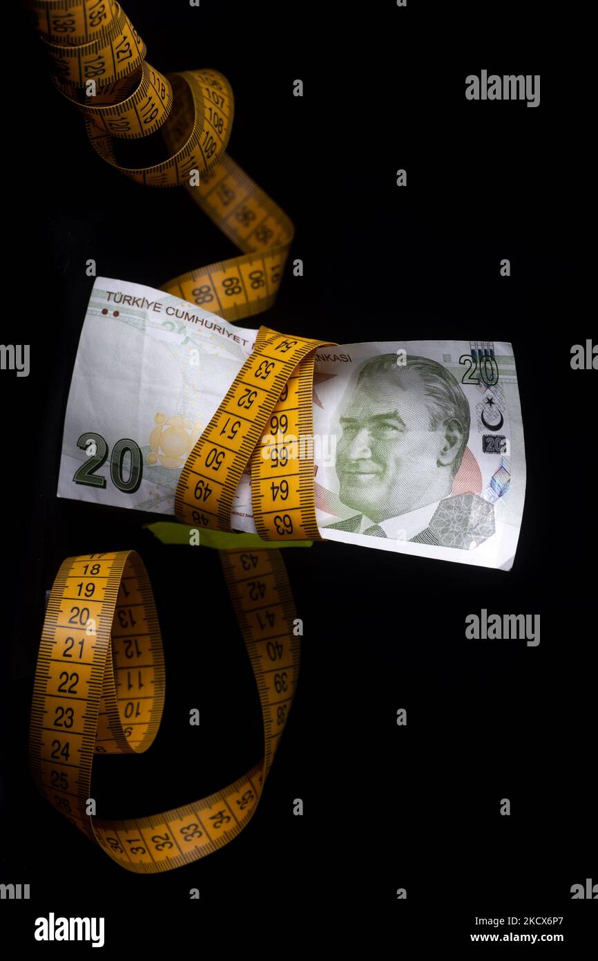 Photo Illustration of Turkish Lira banknotes in black background and a ...