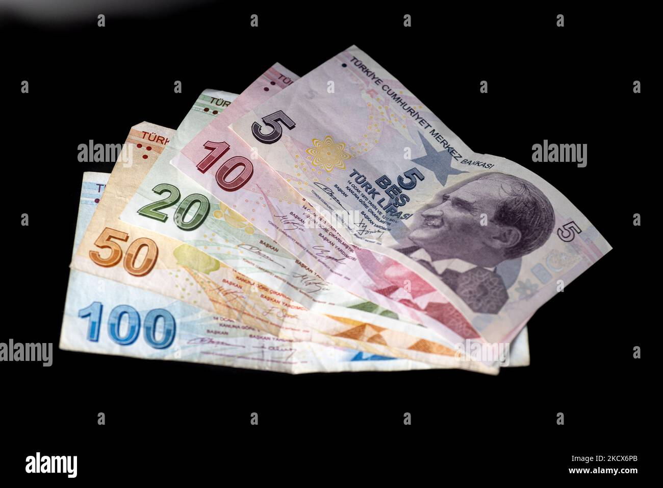 Photo Illustration of Turkish Lira banknotes in black background and a ...