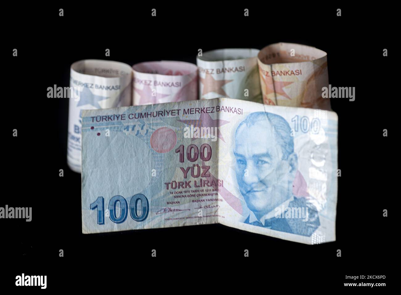 Photo Illustration of Turkish Lira banknotes in black background and a ...