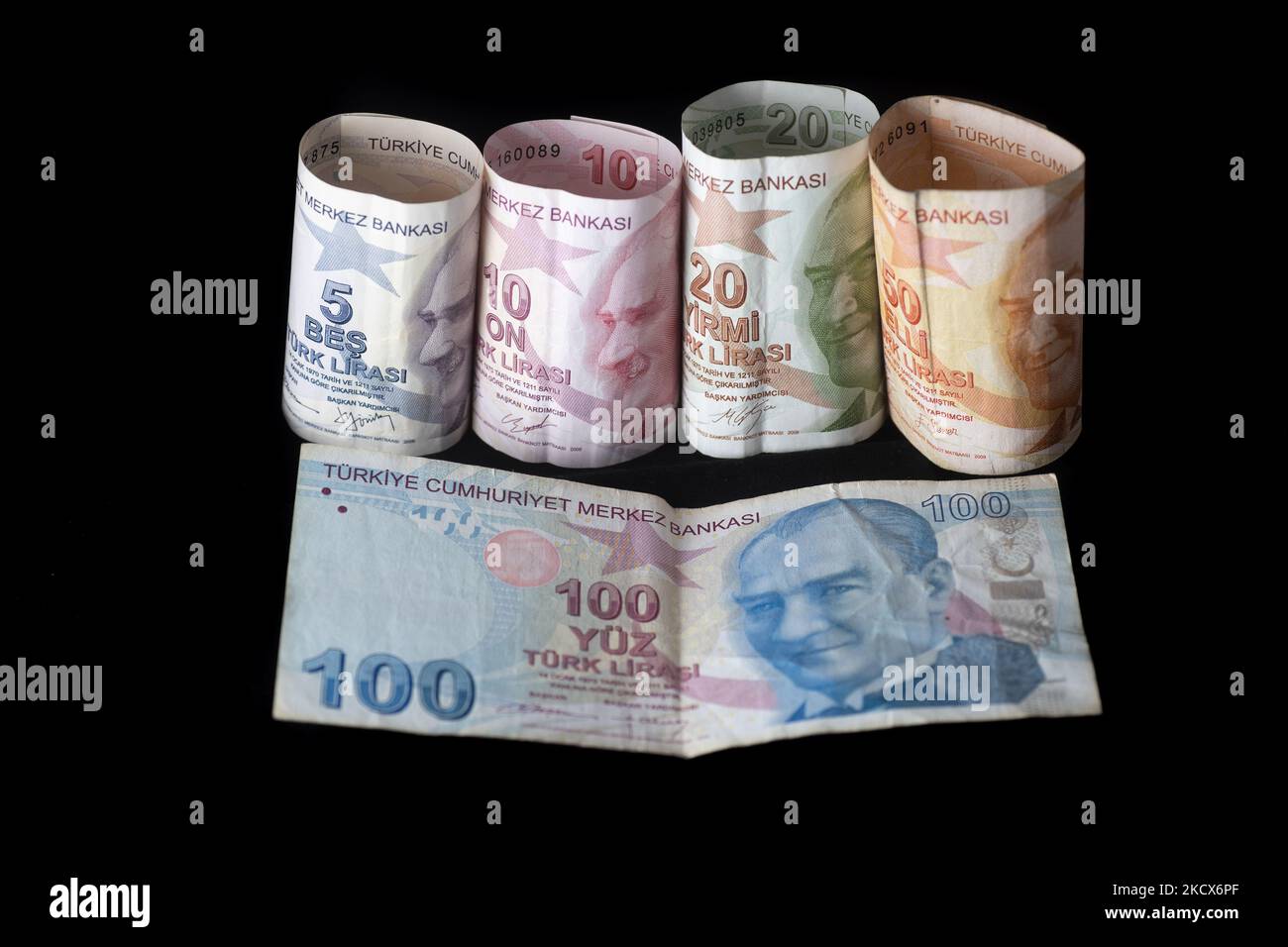 Photo Illustration of Turkish Lira banknotes in black background and a ...