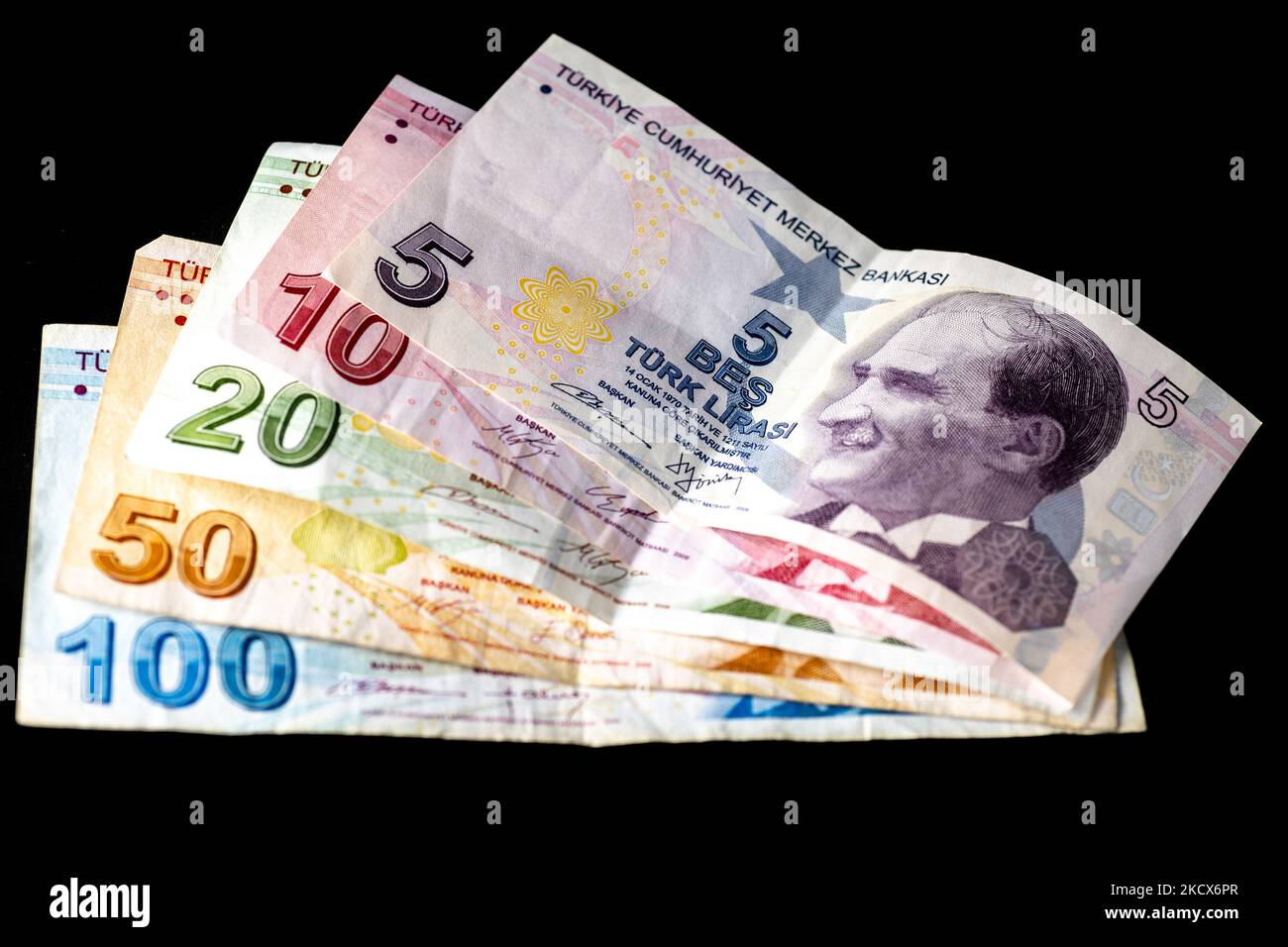 Photo Illustration of Turkish Lira banknotes in black background and a ...
