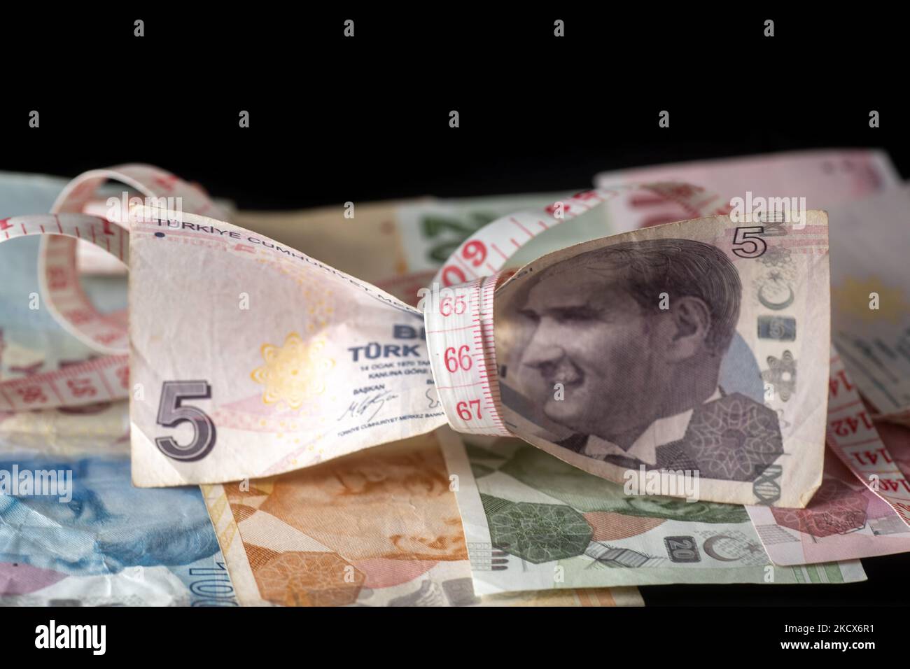 Photo Illustration of Turkish Lira banknotes in black background and a ...