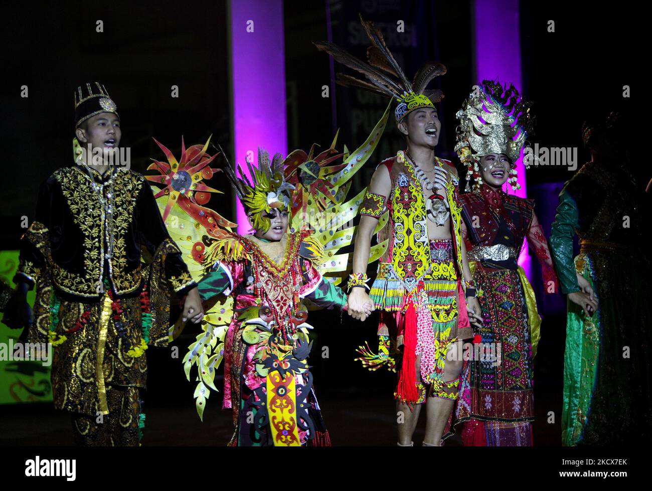 A dance group from Singkawang use a Indonesian traditional clothes in a ...