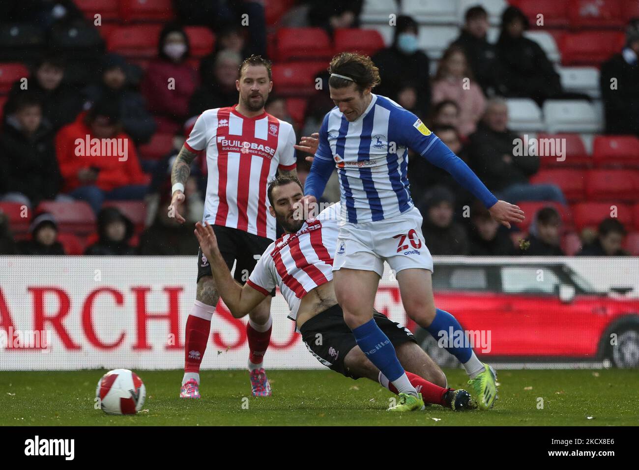 Lincoln City's Adam Jackson and Hartlepool United's Reagan Ogle during ...