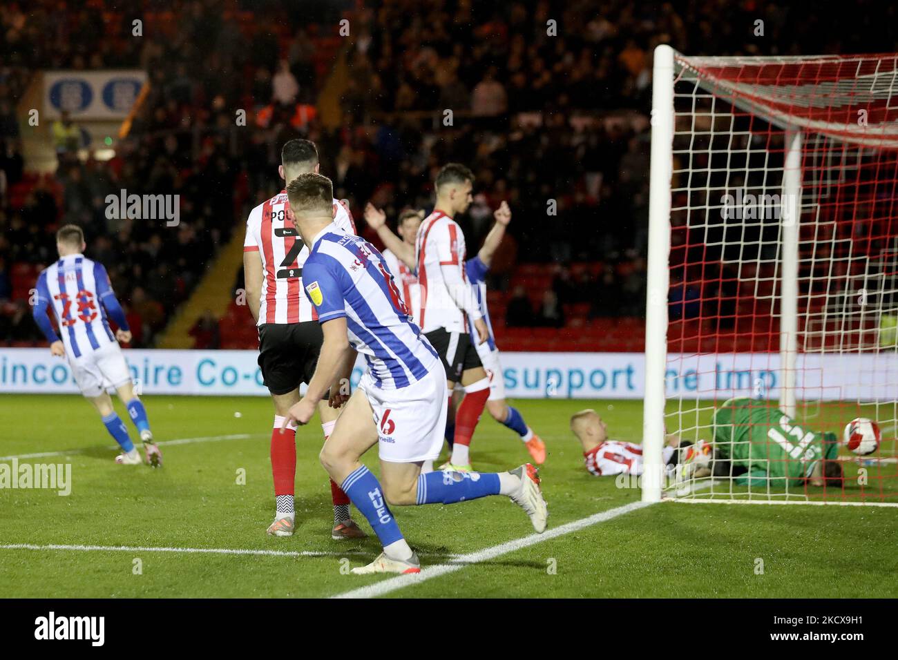 Hartlepool United's Mark Shelton tuens to celebrate after Lewis Fiorini ...