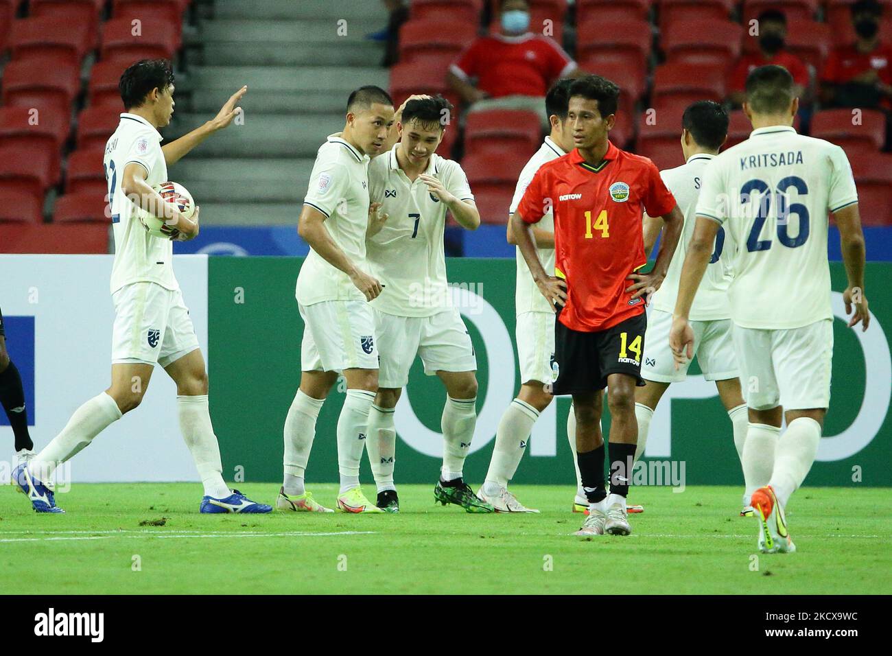 Supachok Sarachat of Thailand (3rd L)celebrates with teammates after ...
