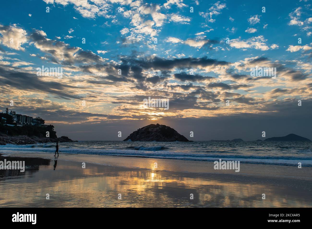 Hong Kong, China, 5 Dec 2021, The rising sun reflects on the Shek O ...