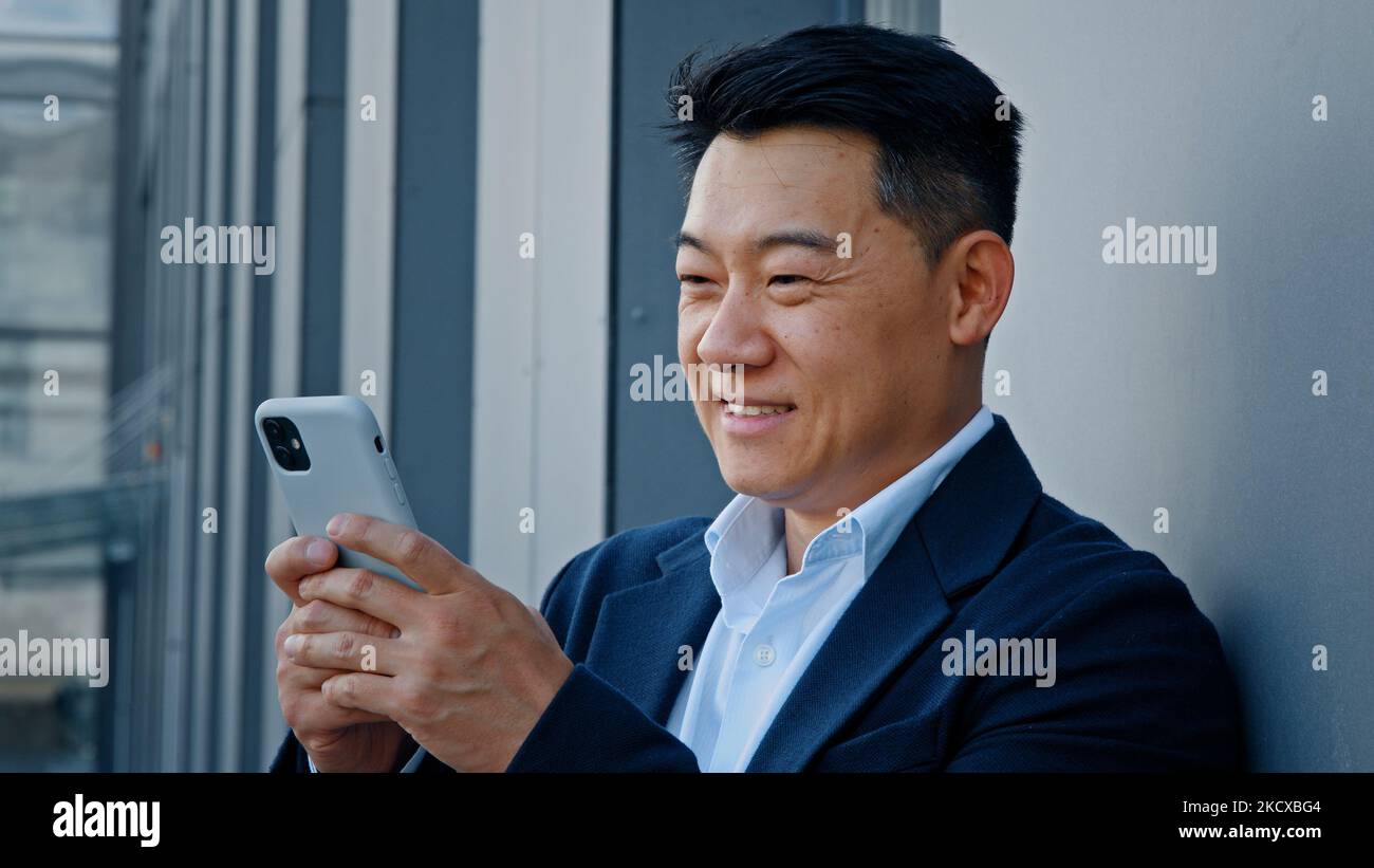 Closeup smiling Asian middle-aged businessman worker man employer ...