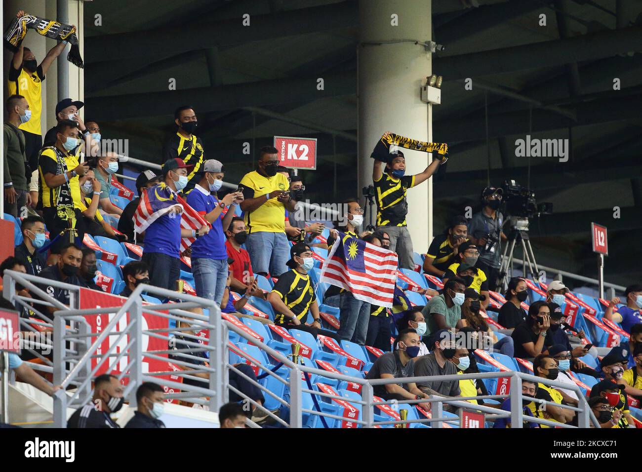 Malaysian fans are seen at the stand during the AFF Suzuki Cup 2020 ...