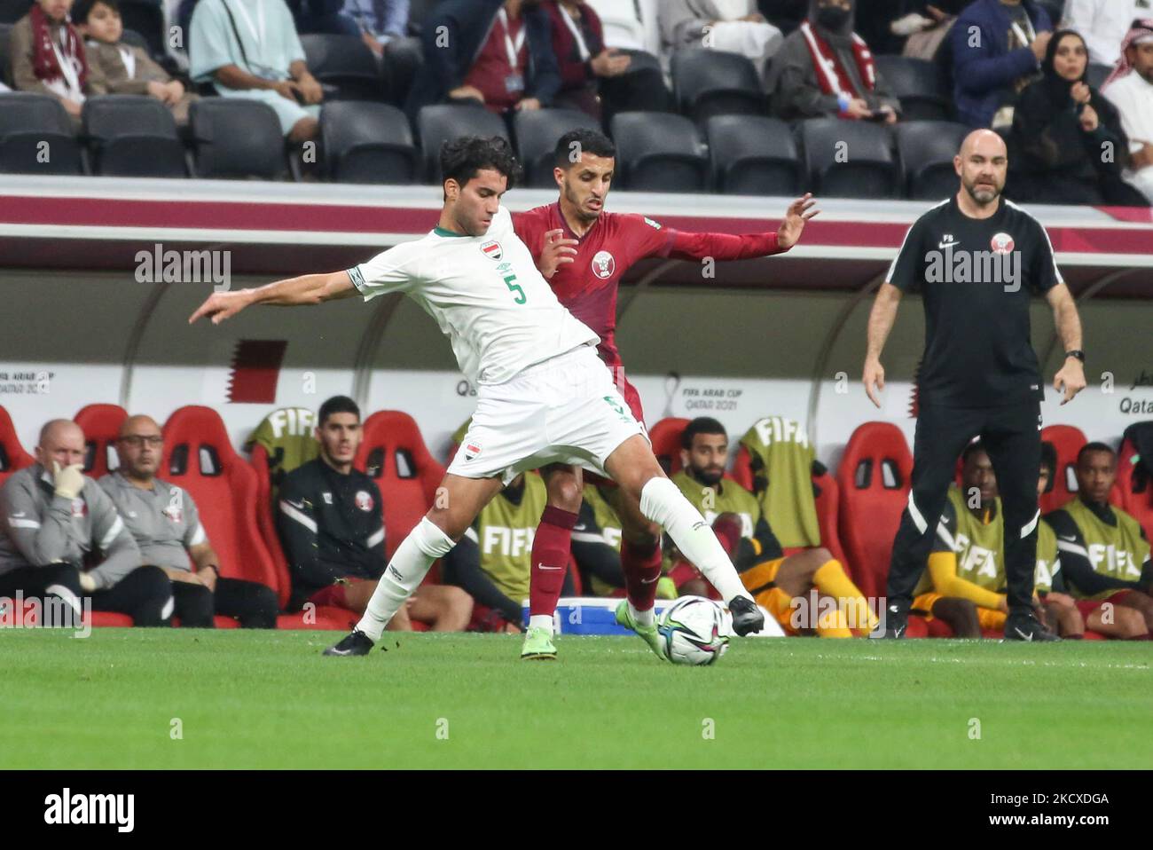 (17) ISMAIL MOHAMAD of Qatar team battles for possession (5) HASAN RAED ...