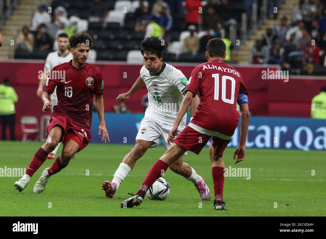 (19) MOHAMMED QASIM of Iraq team battles for possession (18) KHALID ...