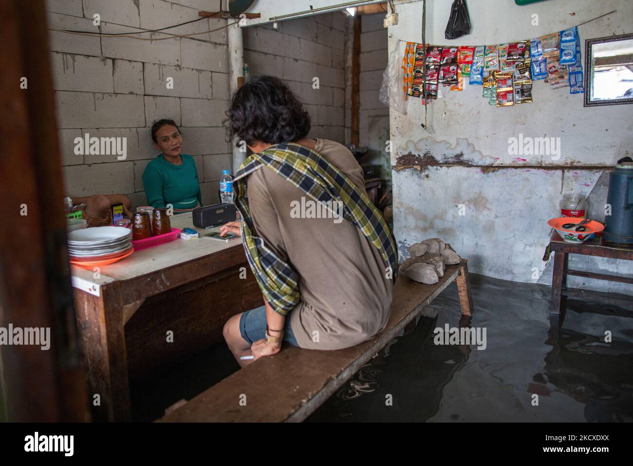 Food stall during a tidal flood at Jakarta's coastal area, Muara Angke ...