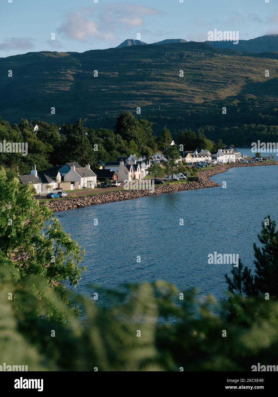 The summer loch and mountain landscape of Loch Shieldaig and village in ...