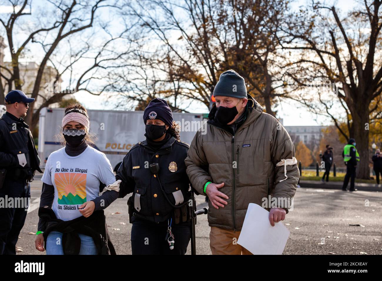 Two immigrants' rights activist are escorted to processing by Capitol ...