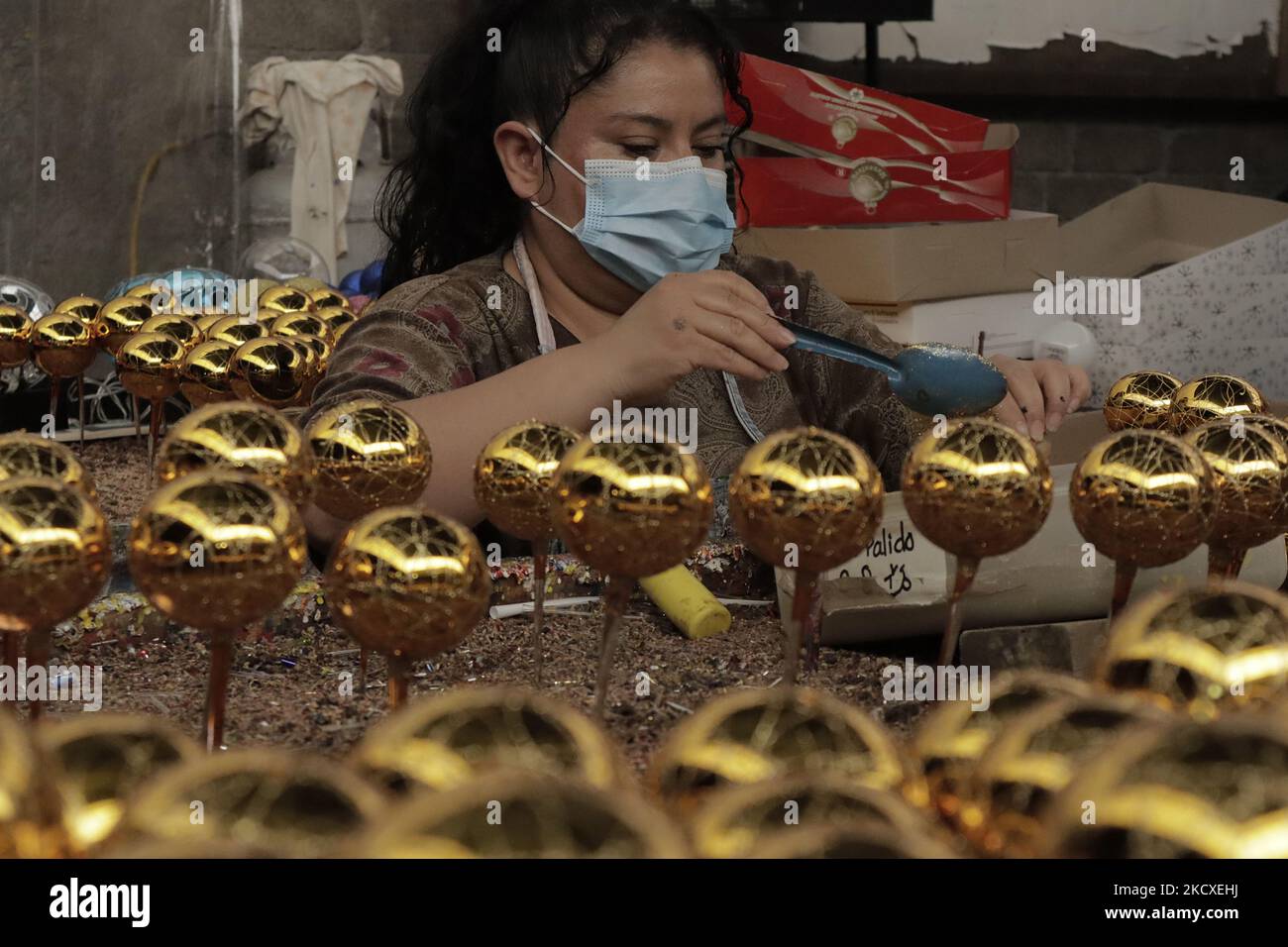 Decoration of handmade blown glass spheres at the Mexican cooperative ...