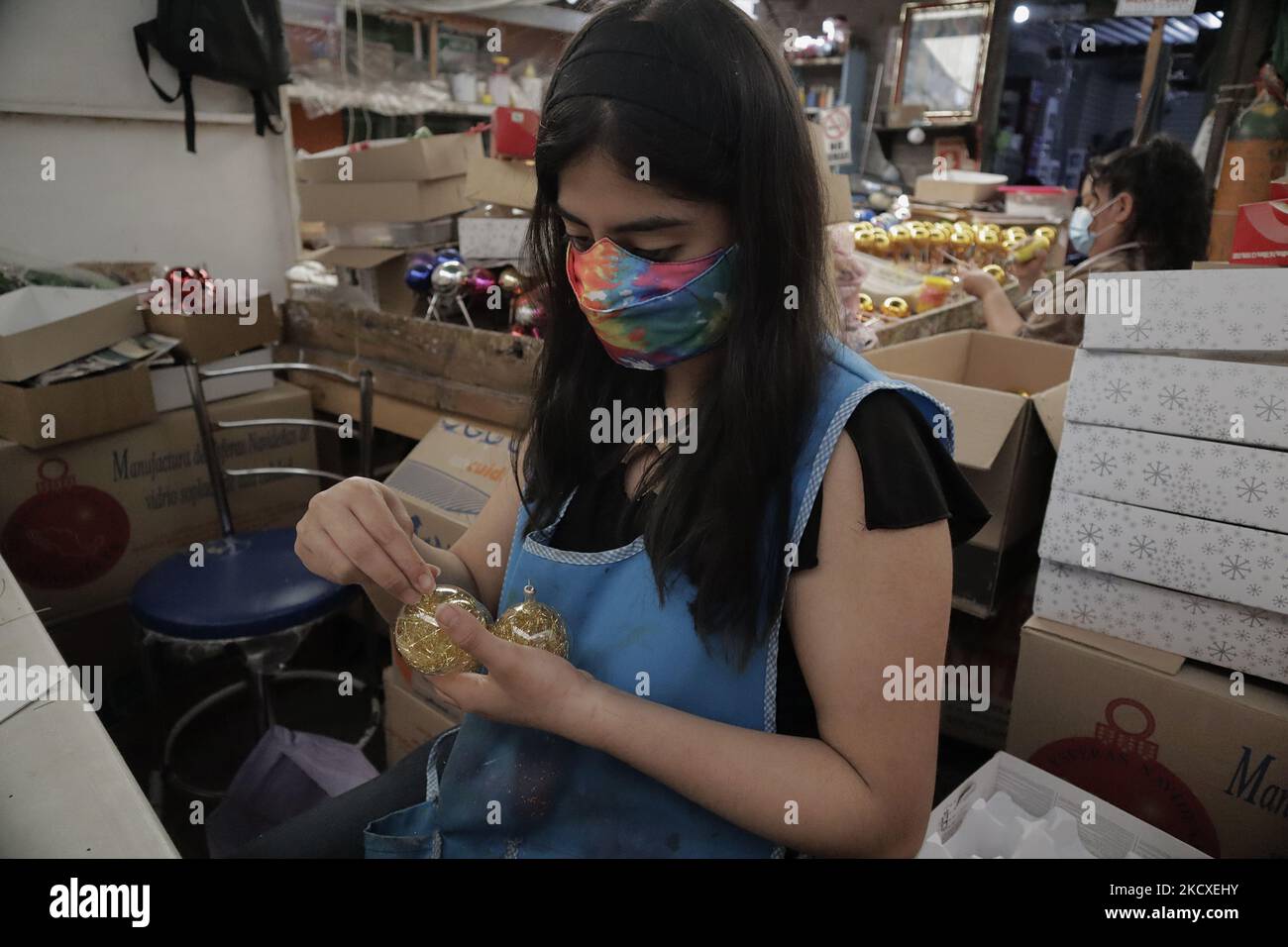 Die-cutting of handmade blown glass spheres at the Mexican cooperative ...